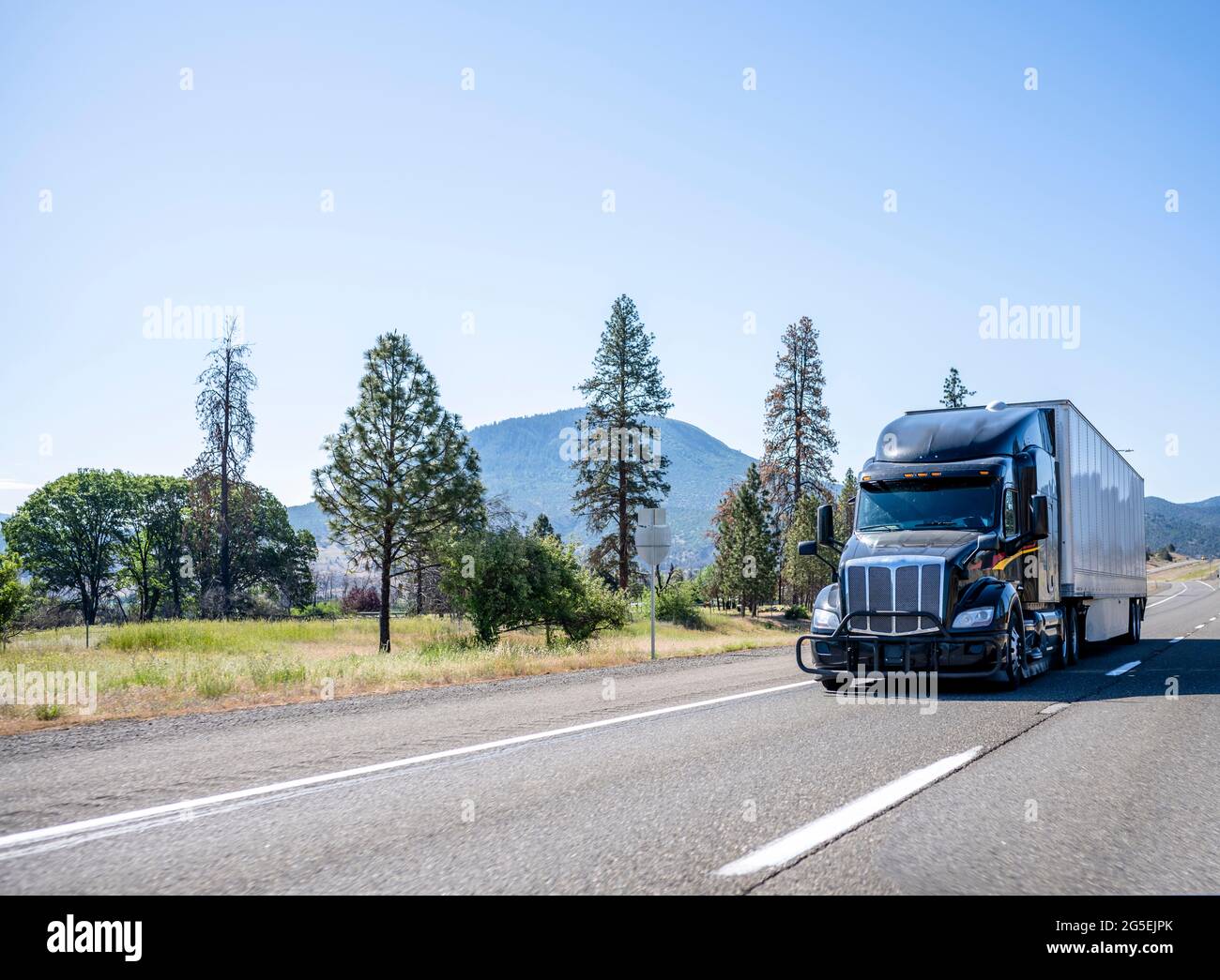Black big rig long haul industrial semi truck with grille guard ...
