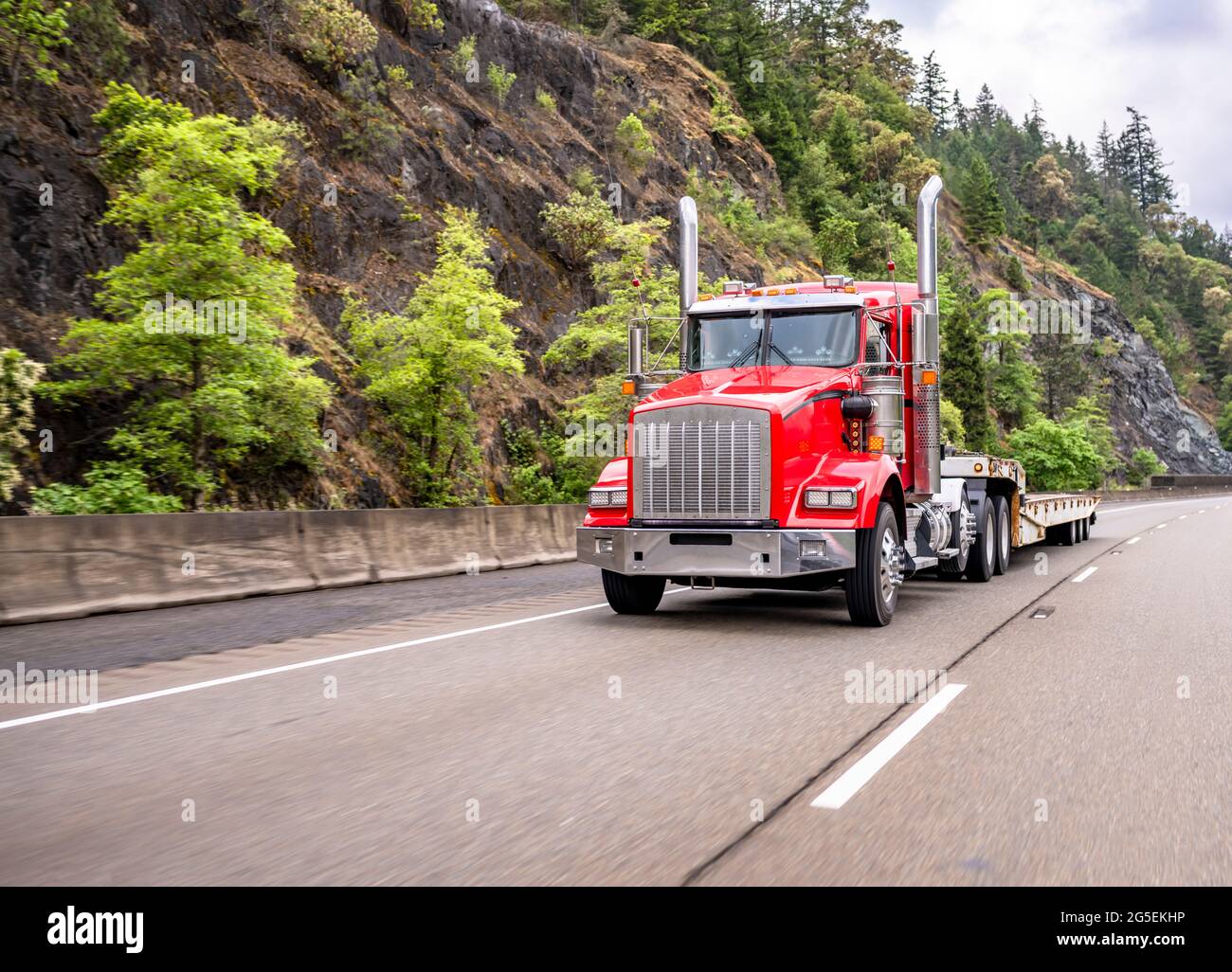 Classic red powerful big rig industrial semi truck tractor with day cab ...
