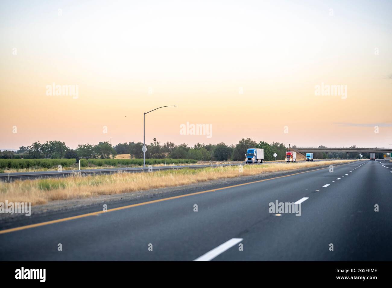 Team of group big rigs industrial professional semi trucks tractors ...