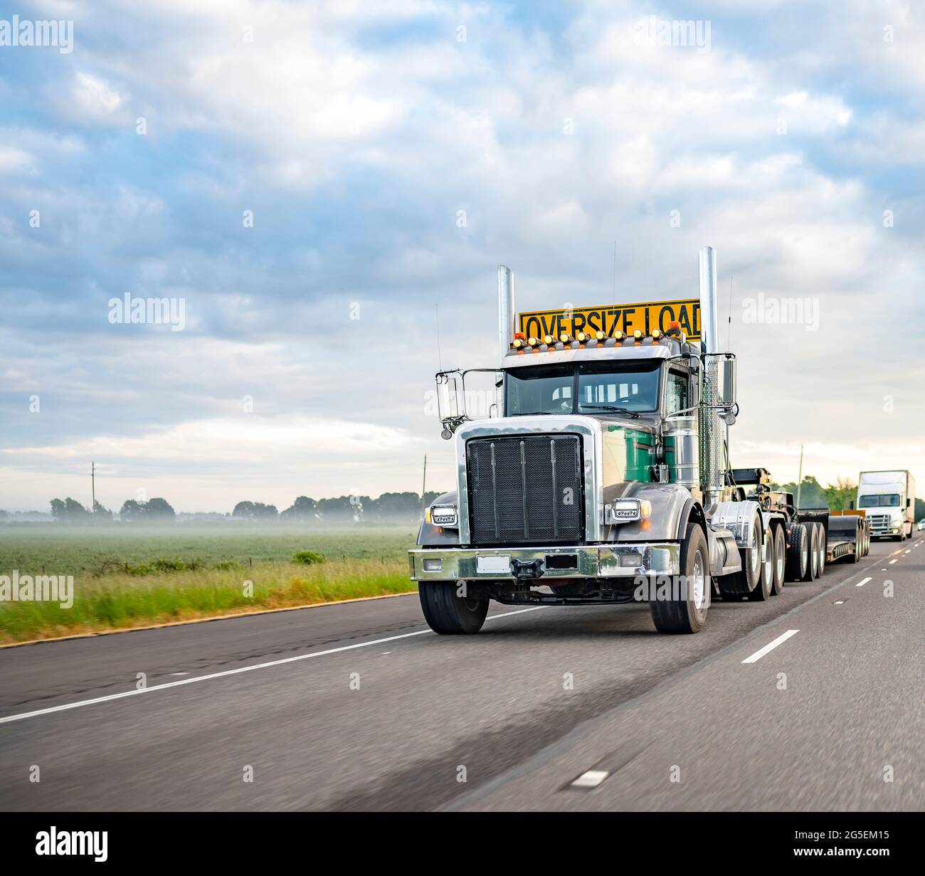 American idol green classic day cab big rig semi truck with turned on ...