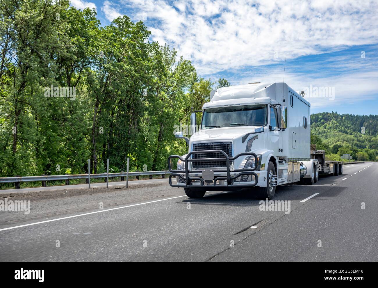 Classic white powerful big rig industrial semi truck tractor with long ...