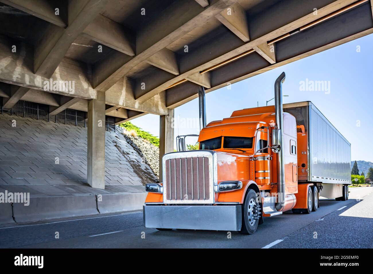 Orange Big rig long haul industrial semi truck tractor with chrome ...