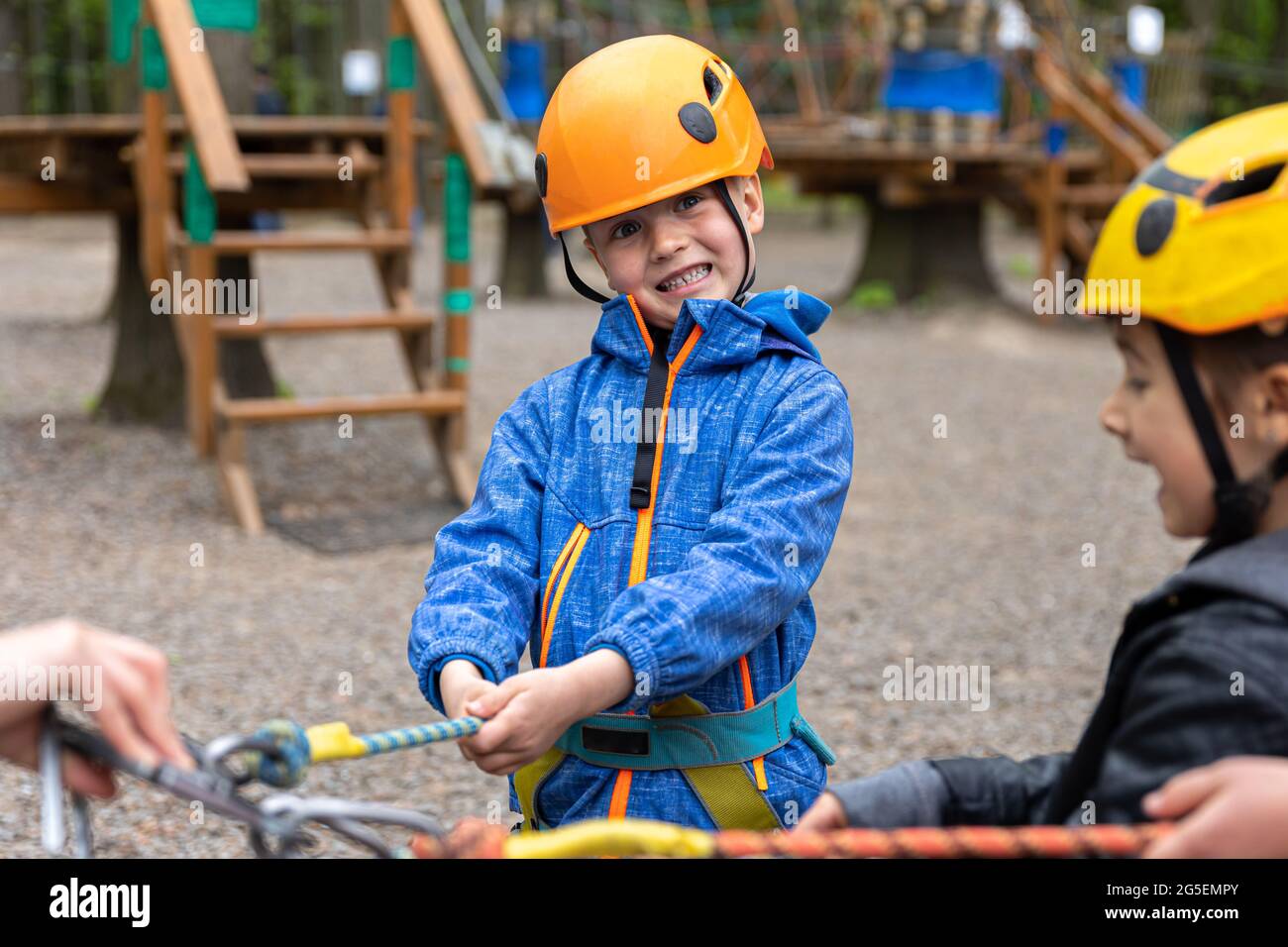 Adventure climbing high wire park - children on course in mountain ...