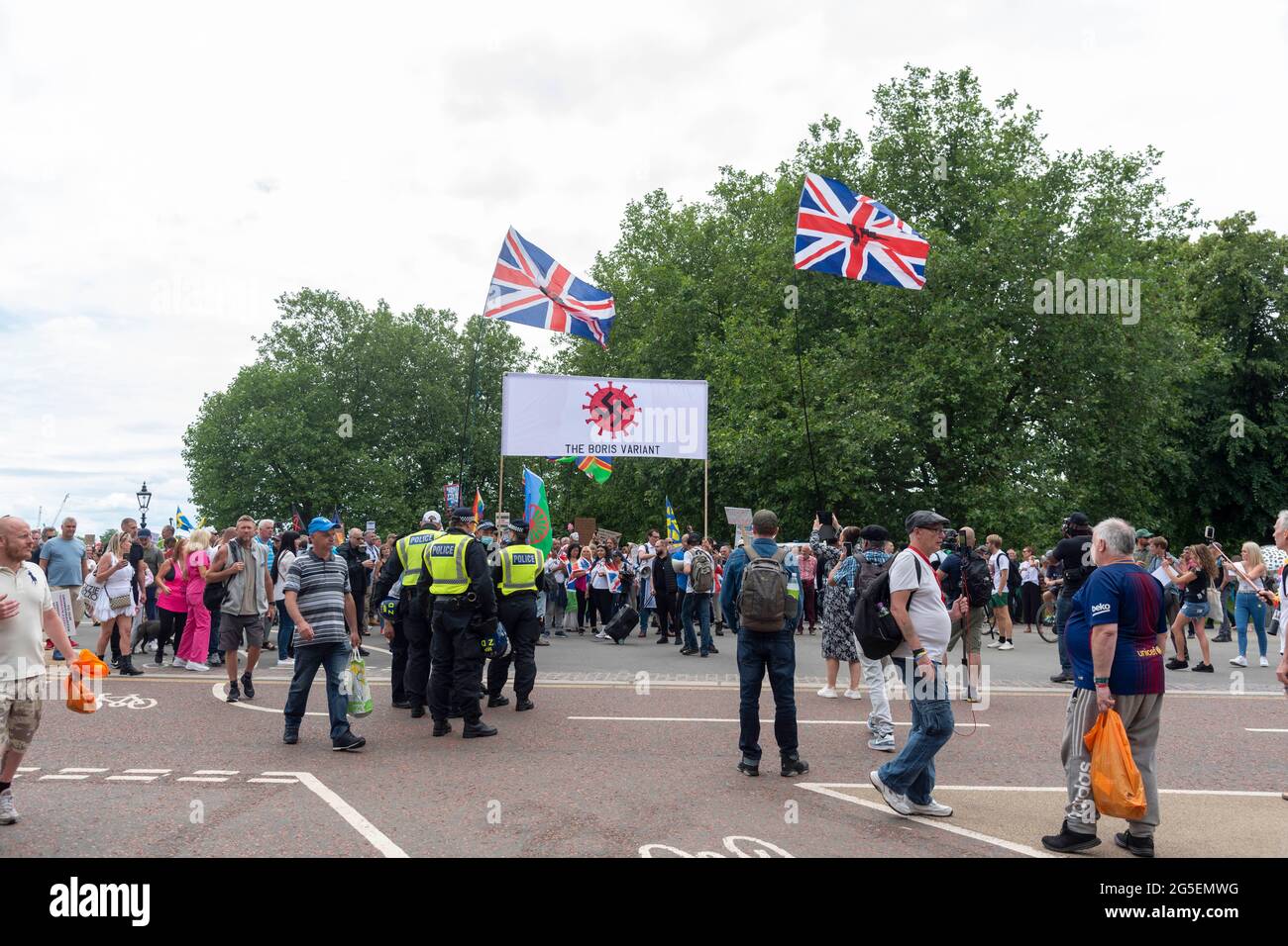 Protesters leave Hyde Park in London with a banner saying ‘The Boris ...