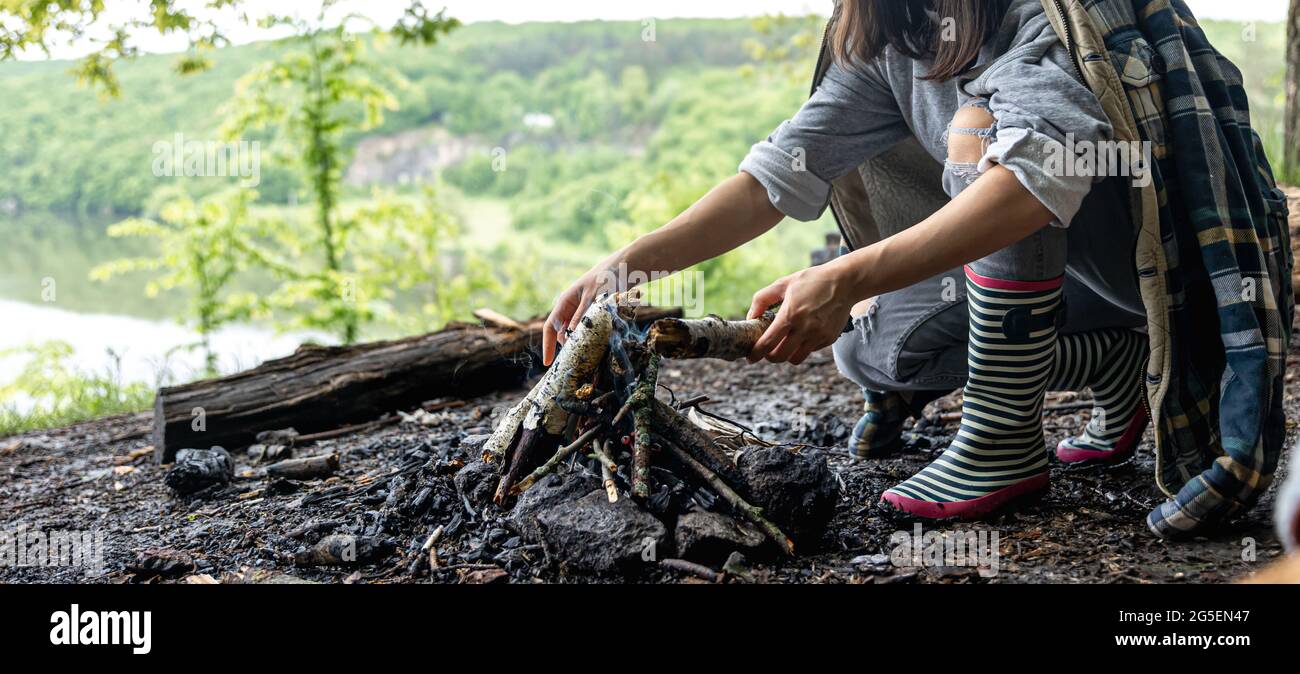 The process of making a fire in nature in the forest Stock Photo - Alamy
