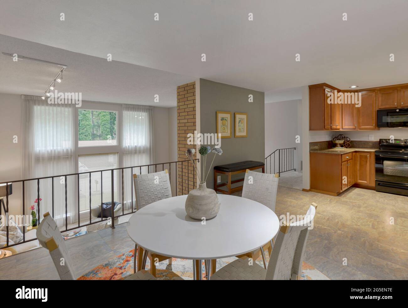 Modern residential dining room and kitchen interior Stock Photo - Alamy