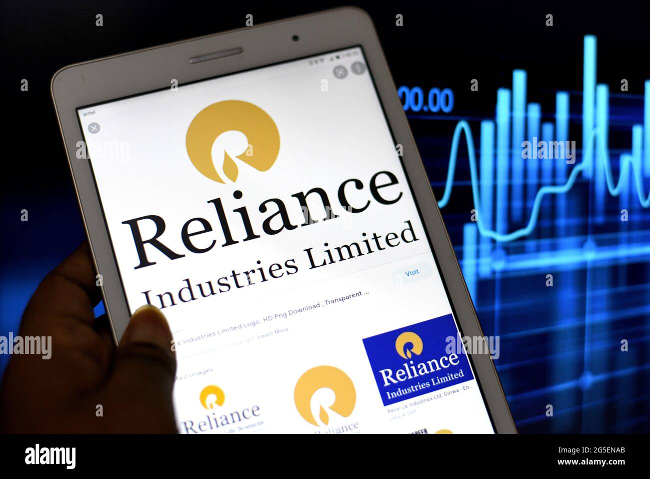 In this Photo illustration the Reliance company logos seen displayed on ...
