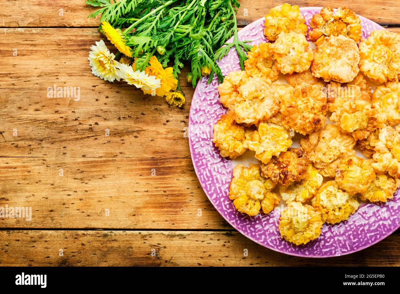 Tasty fried edible flowers. Chrysanthemum flowers in batter.Deep fried ...
