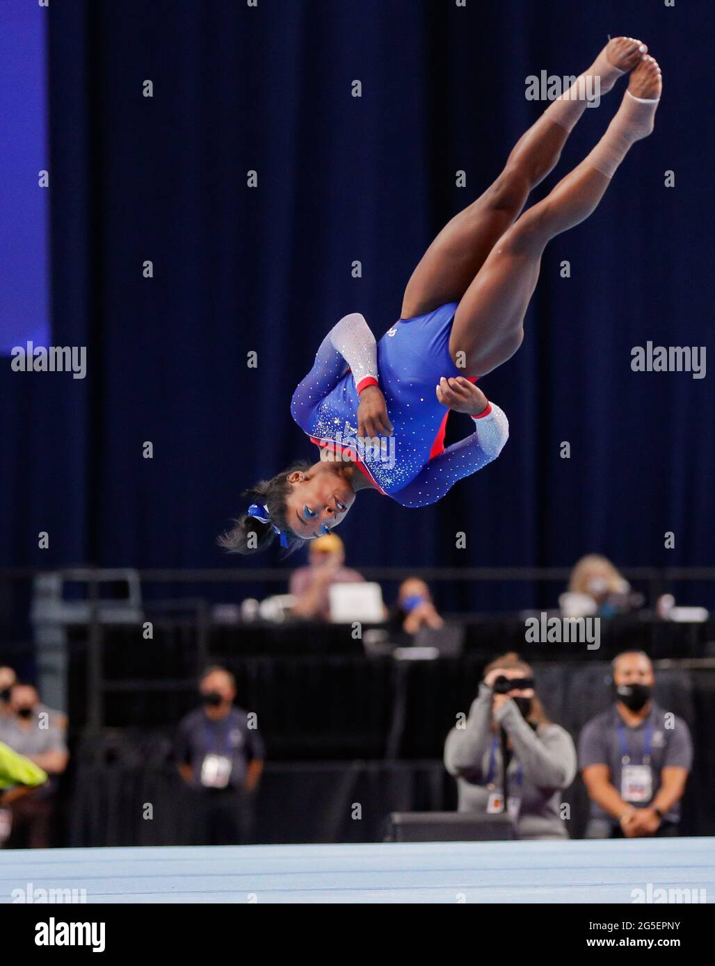 June 25, 2021: Simone Biles twists in the air during her floor routine ...