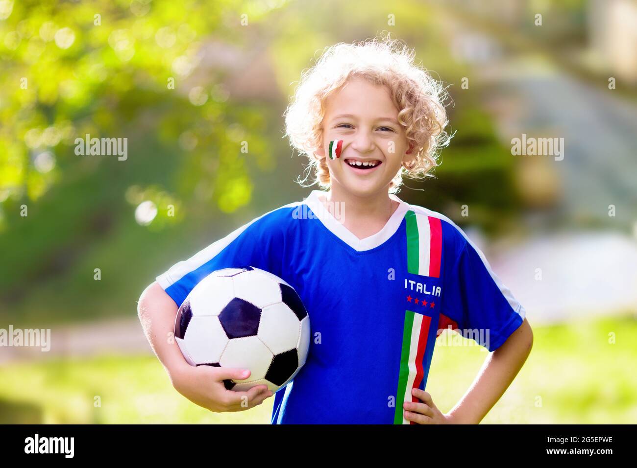 Italy football fan. Italian kids play soccer on outdoor field. Cheering ...