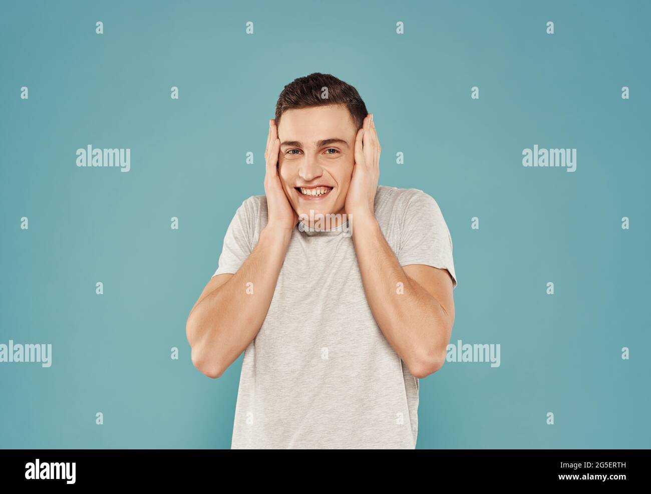 cute emotional man smile emotion blue background Stock Photo - Alamy
