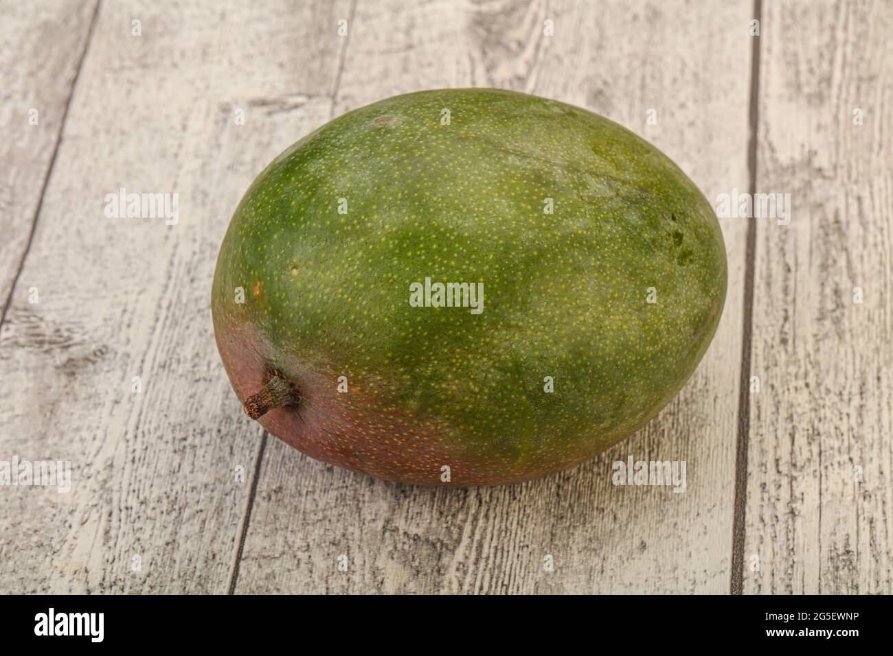 Tropical fruit - Green sweet tasty mango Stock Photo - Alamy