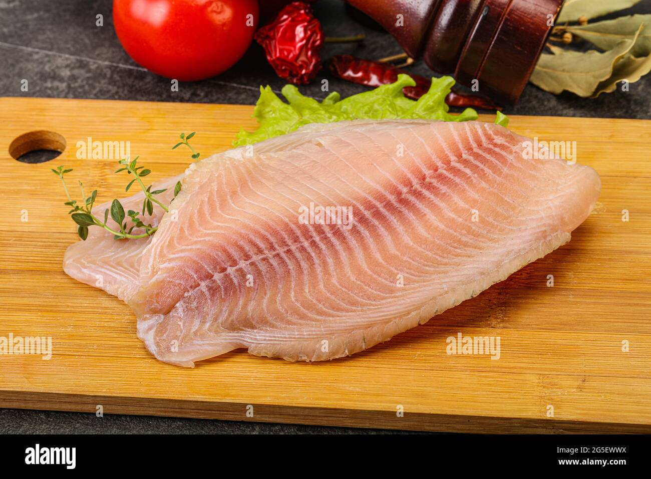 Raw tilapia fish fillet for cooking Stock Photo - Alamy