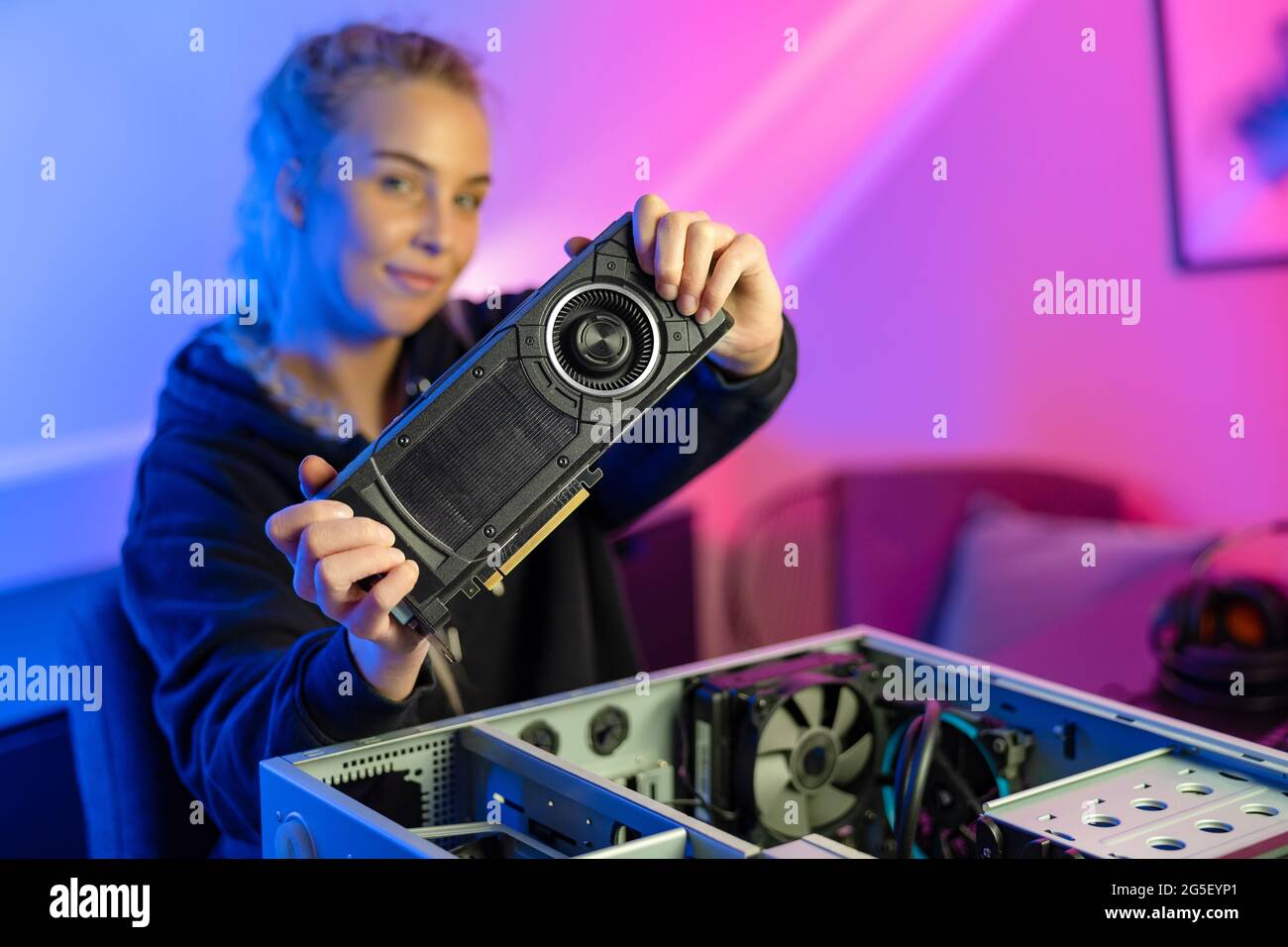 Blonde Gamer Girl Holding a New GPU Video Card in Her Hands Stock Photo ...