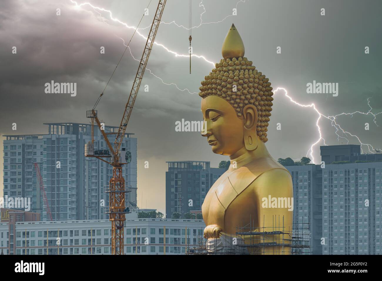 Gigantic Buddha statue under construction with lightning streak in ...