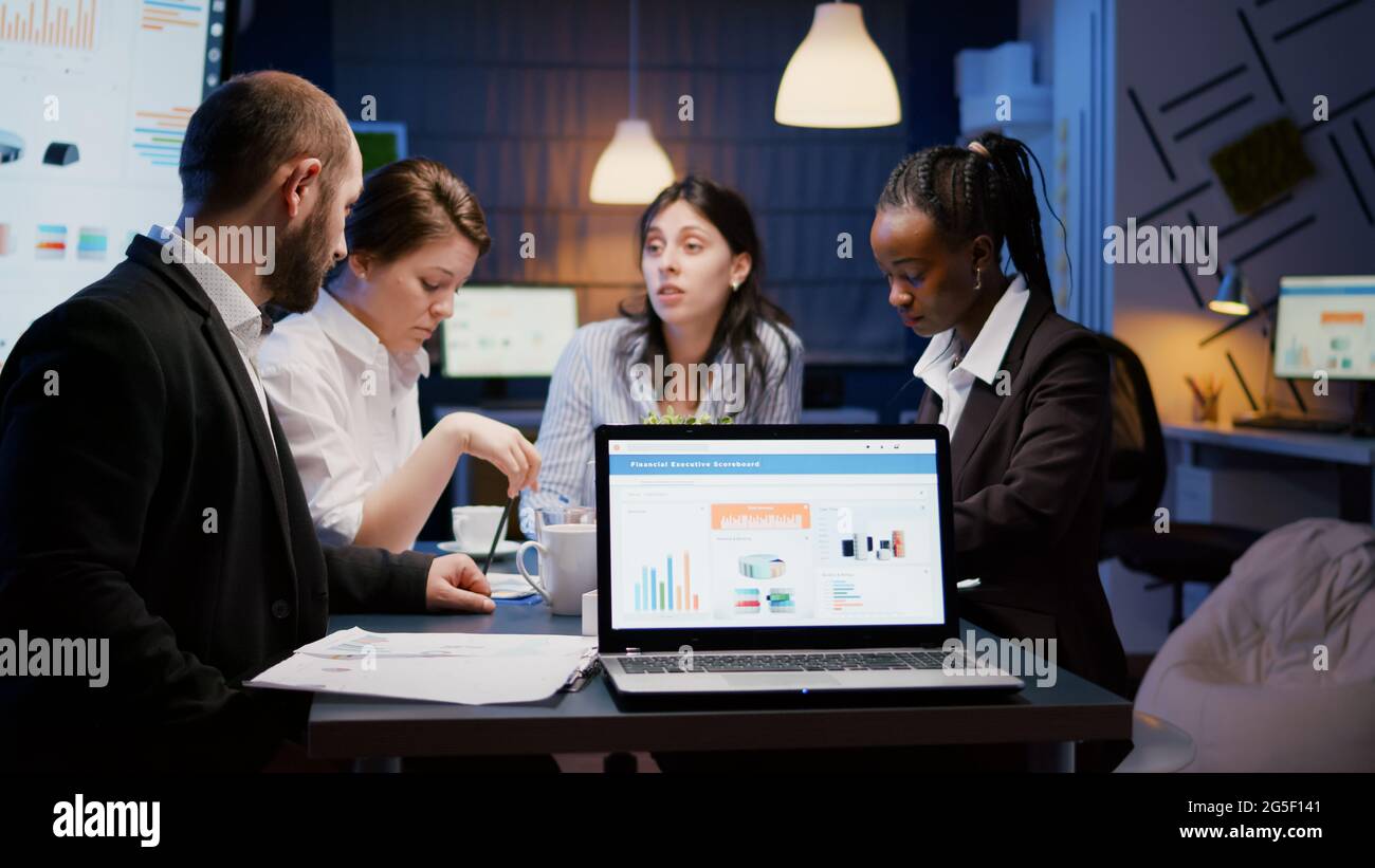 Laptop computer with financial graphs presentation on monitor standing ...