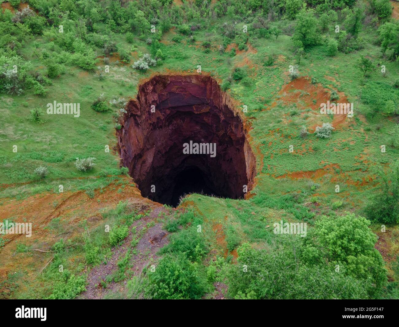 overhead view of collapsed mine big hole in land Stock Photo - Alamy