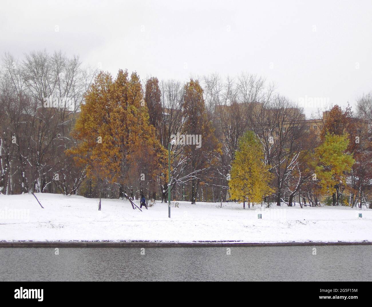 early melting snow, november, city park Stock Photo - Alamy