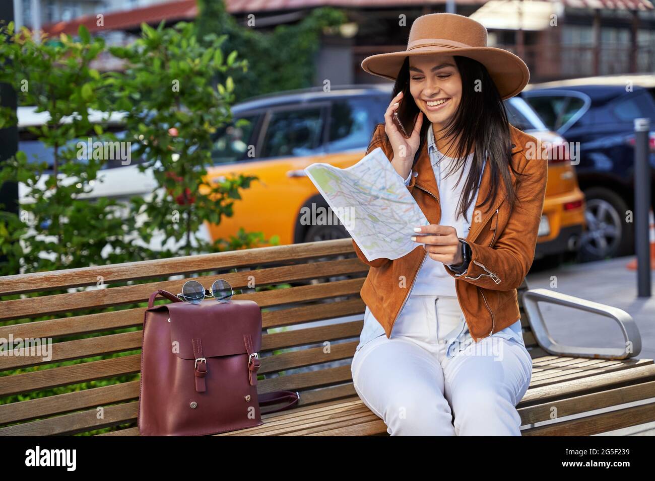 Happy pretty lady resting on bench outdoor Stock Photo - Alamy