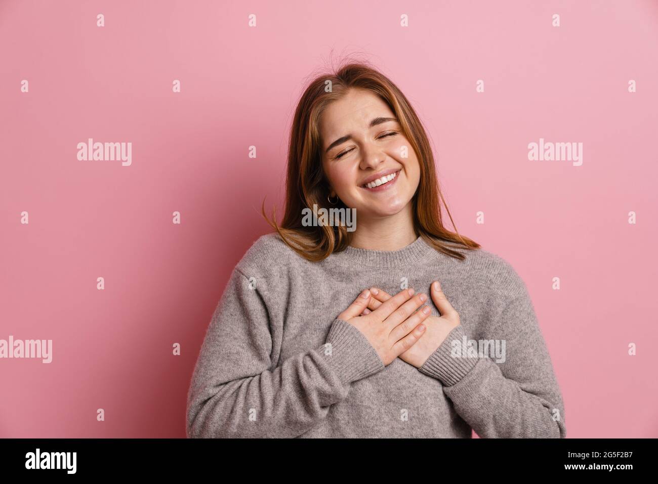 Hand on chest woman happy hi-res stock photography and images - Alamy