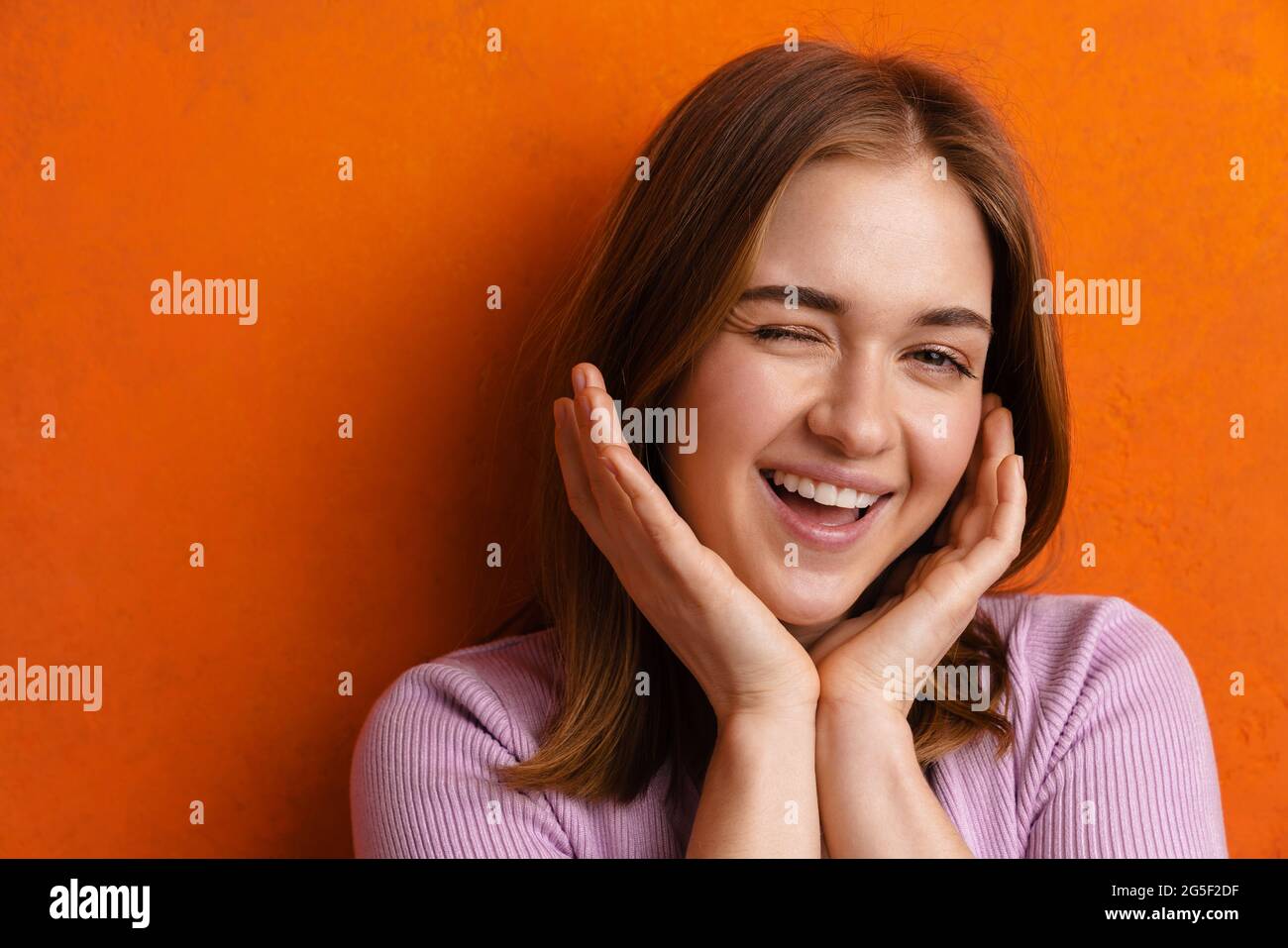 Young ginger woman winking hi-res stock photography and images - Alamy