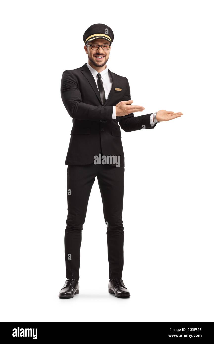 Full length portrait of a young chauffeur showing a direction isolated ...