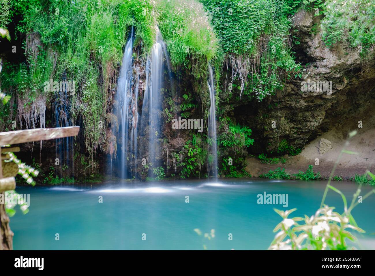 small beautiful waterfall with blue lake Stock Photo - Alamy