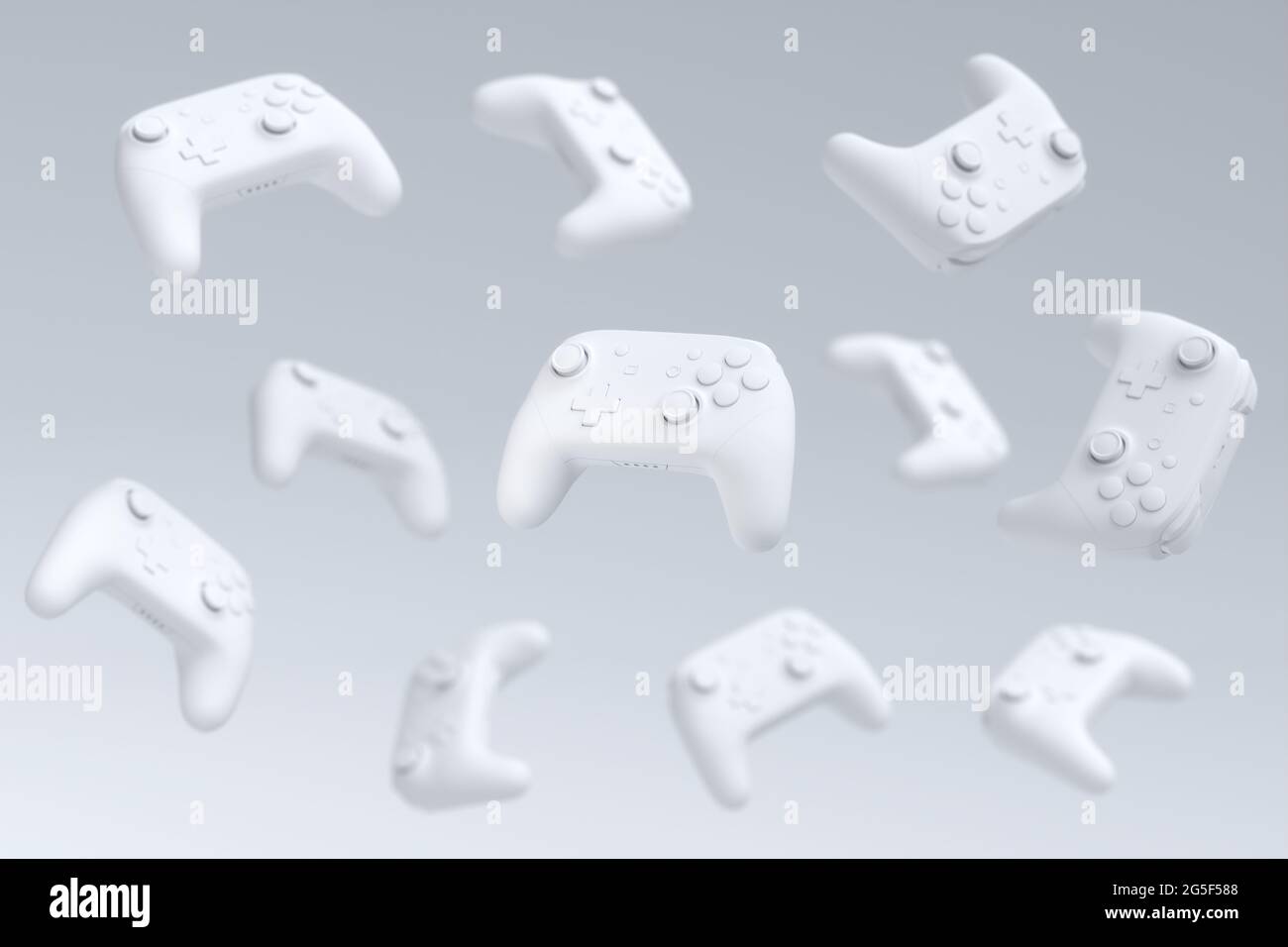 Flying gamer joysticks or gamepads on white background with blur Stock ...