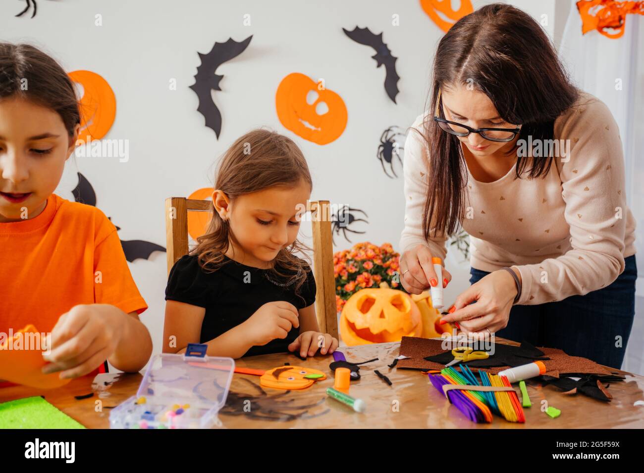 Happy children during Halloween art lesson at home Stock Photo - Alamy