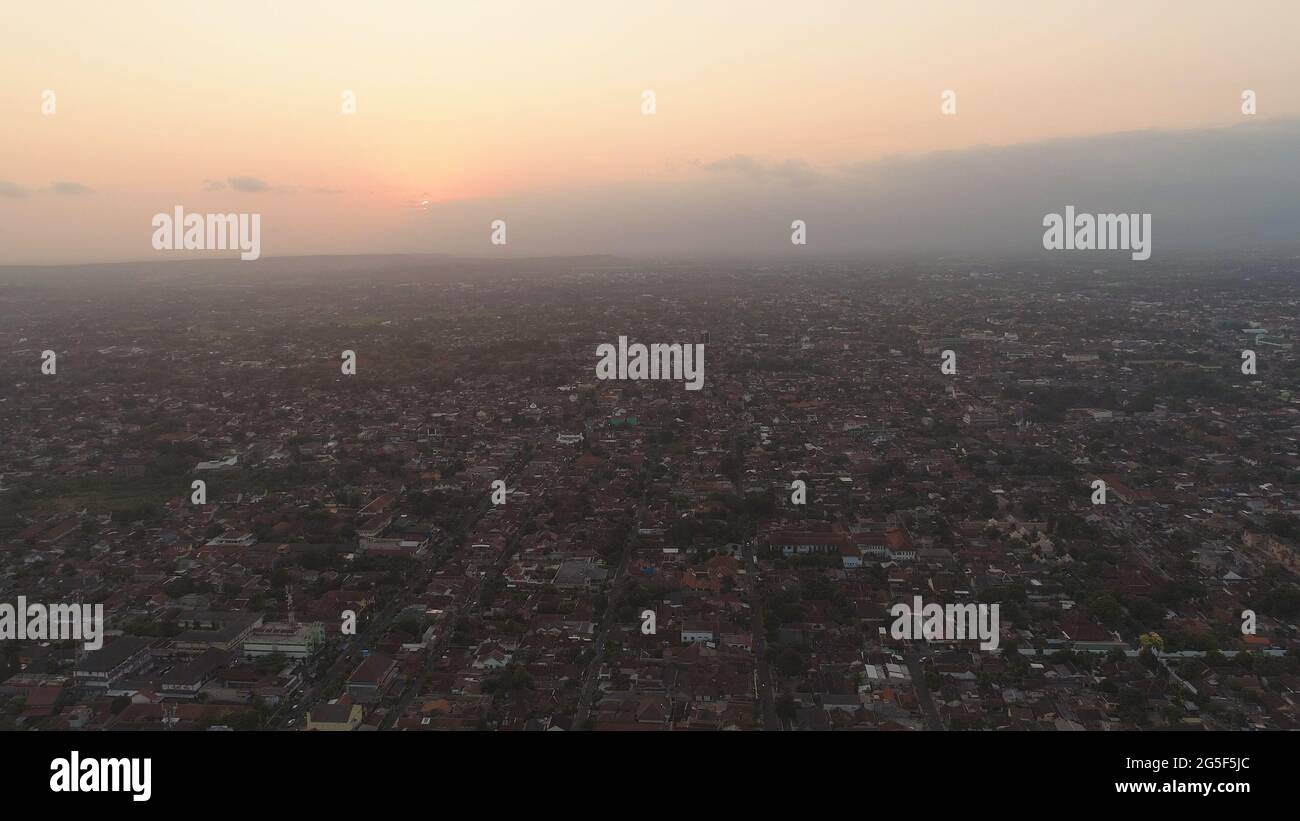 cityscape Yogyakarta with buildings, highway at sunset time. aerial ...