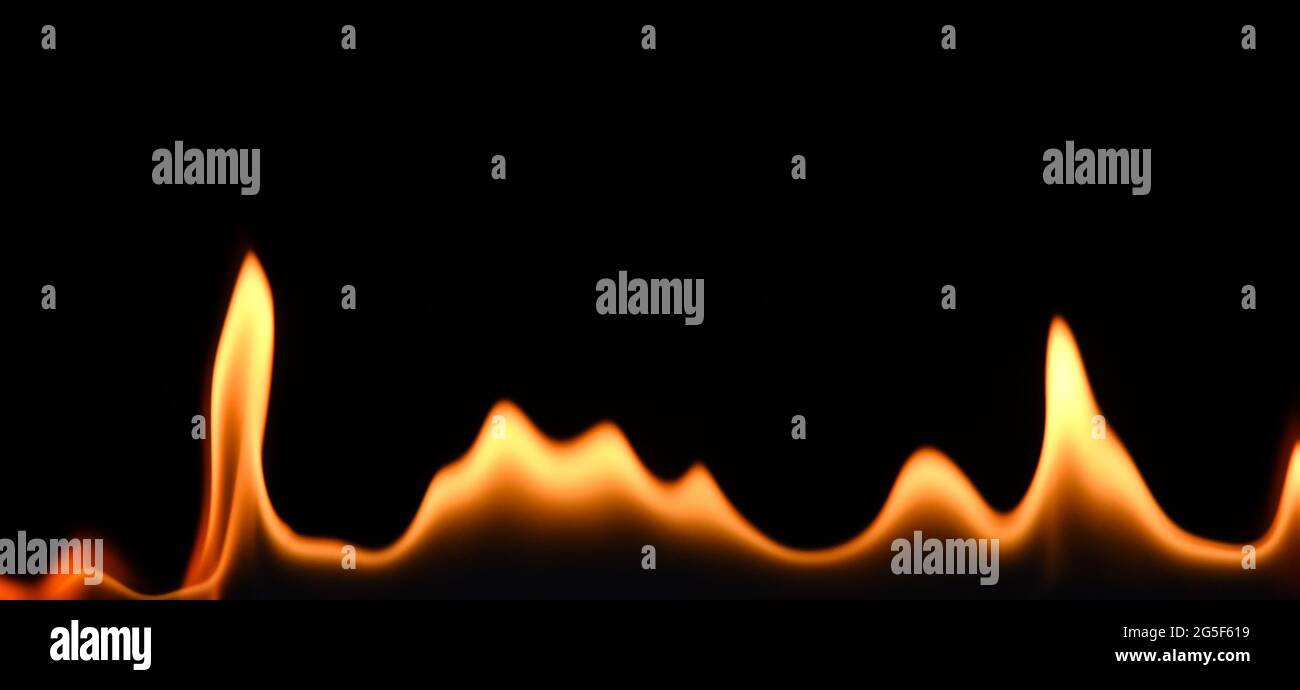 Close up line of fire flames pattern isolated on black background, low ...