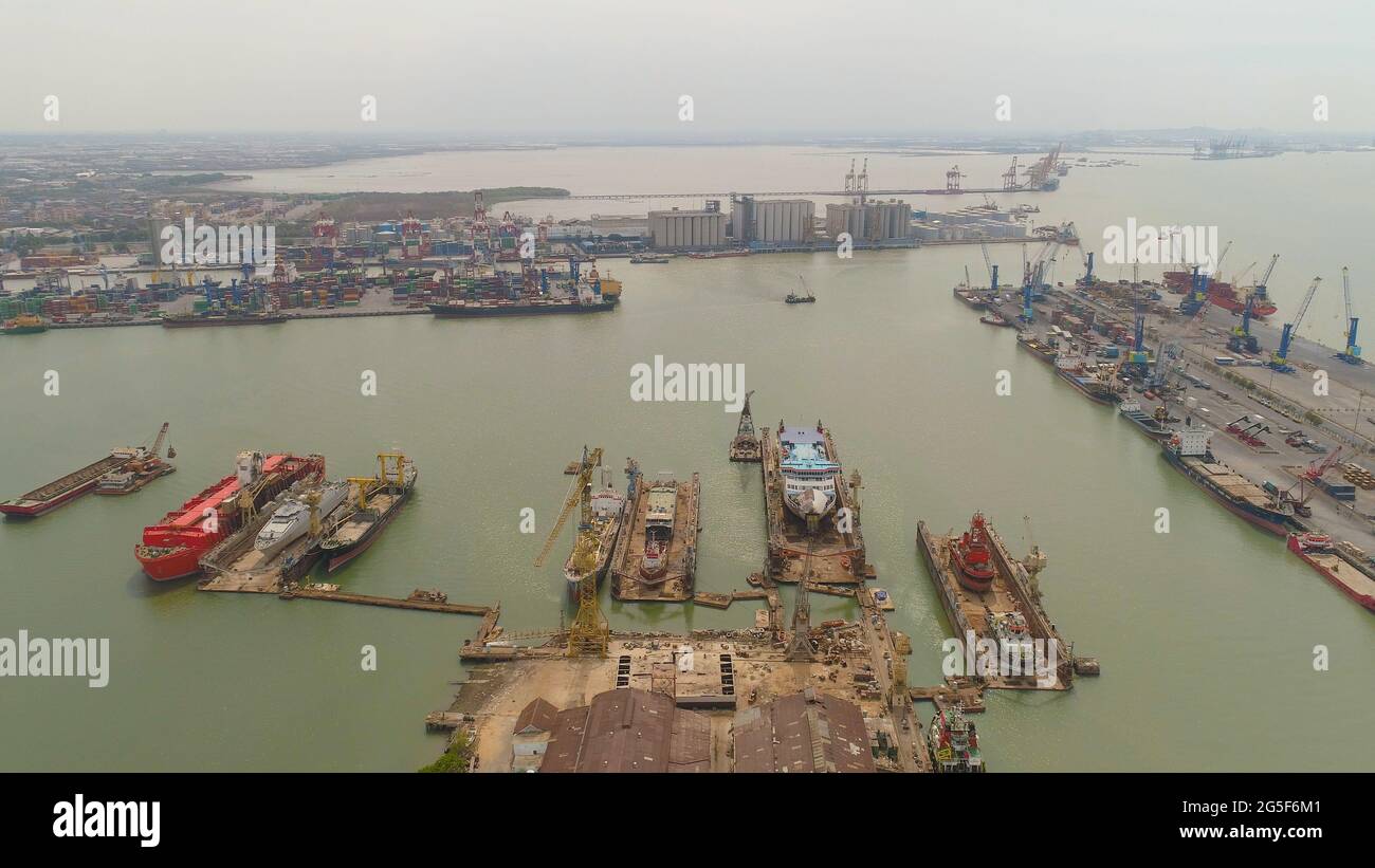 aerial view cargo and passenger seaport with ships and crane Tanjung ...