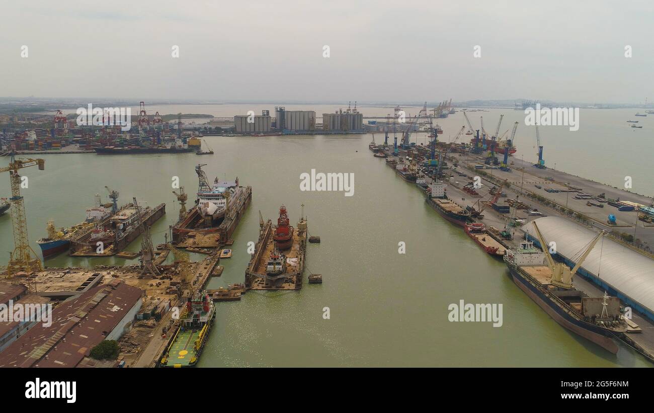 aerial view cargo and passenger seaport with ships and crane Tanjung ...