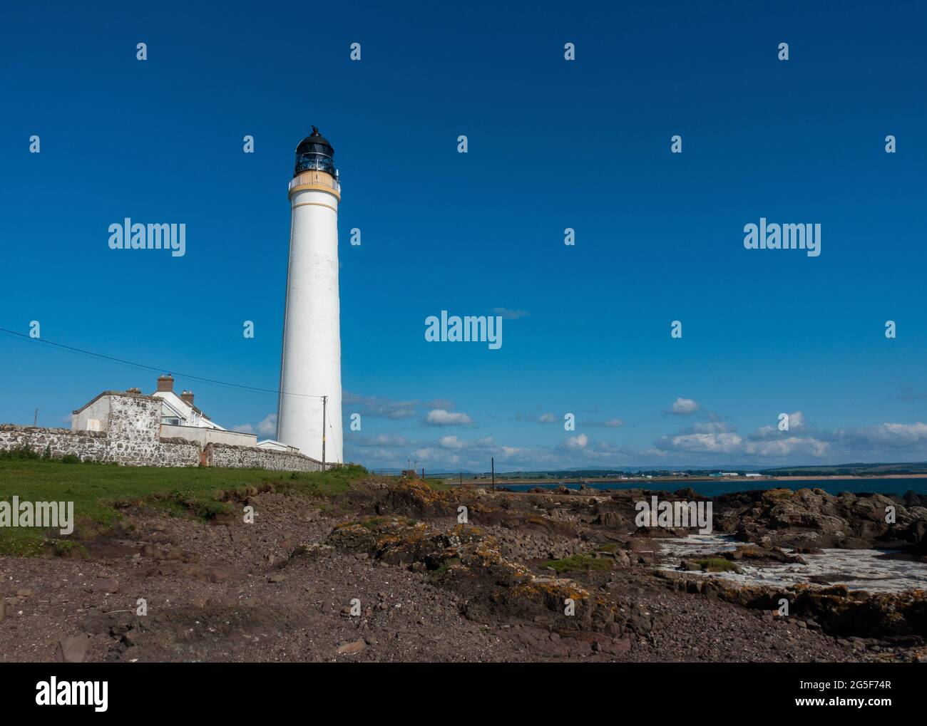 The lighthouse at the rocky headland of Scurdie Ness, Ferryden near ...