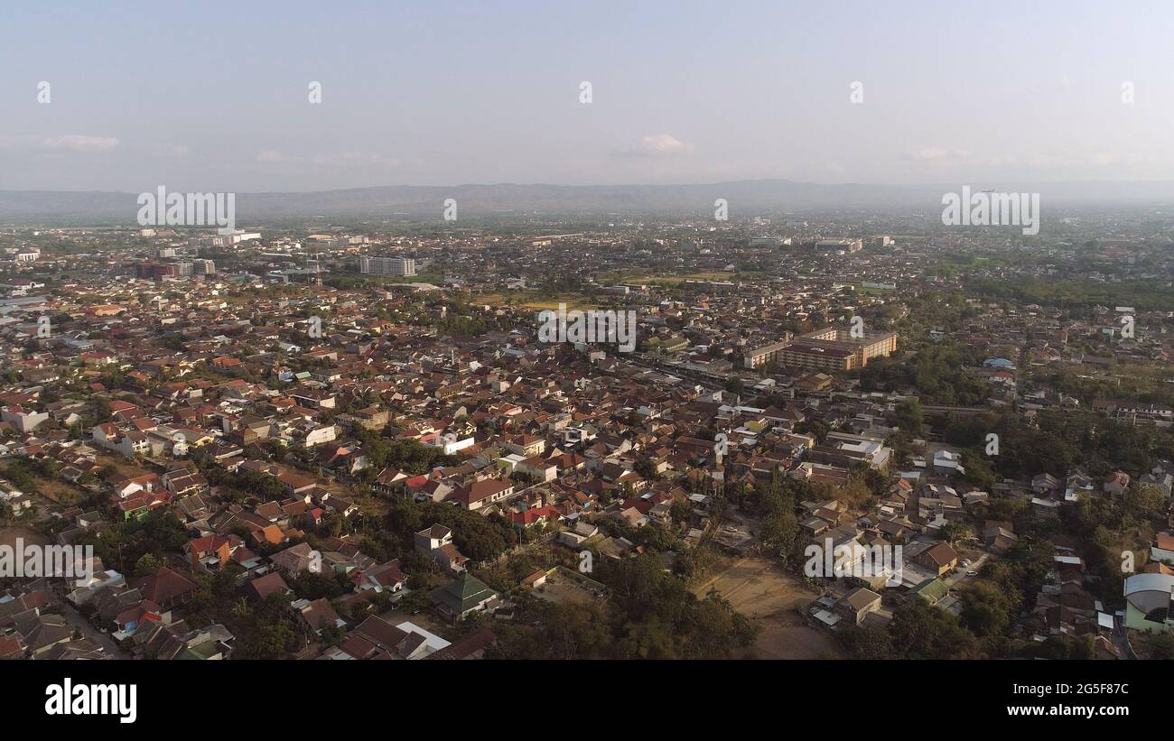 cityscape Yogyakarta with buildings, highway at sunset time. aerial ...