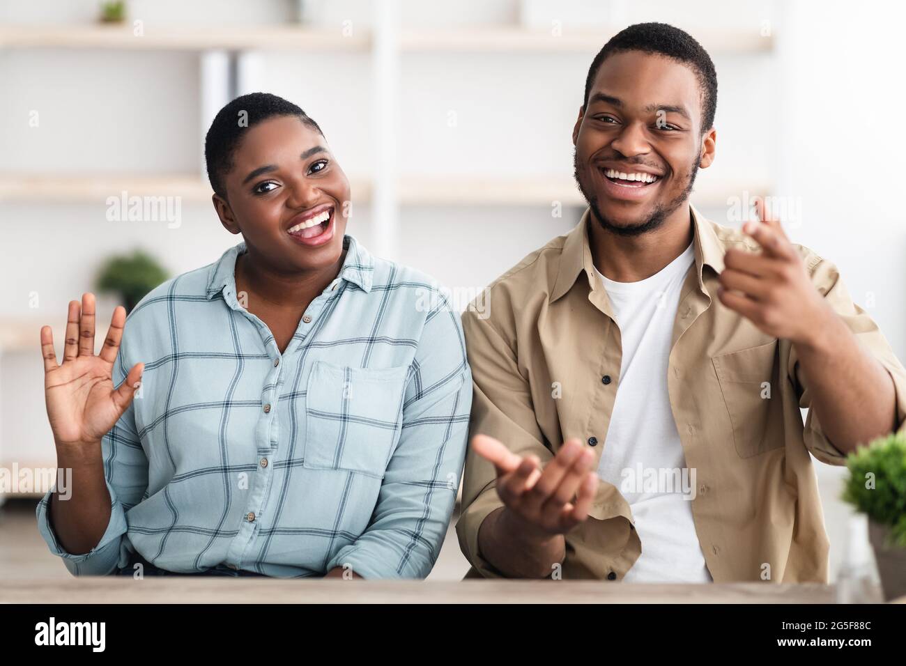 Hello. Happy African American Family Couple Waving Hand Smiling To ...