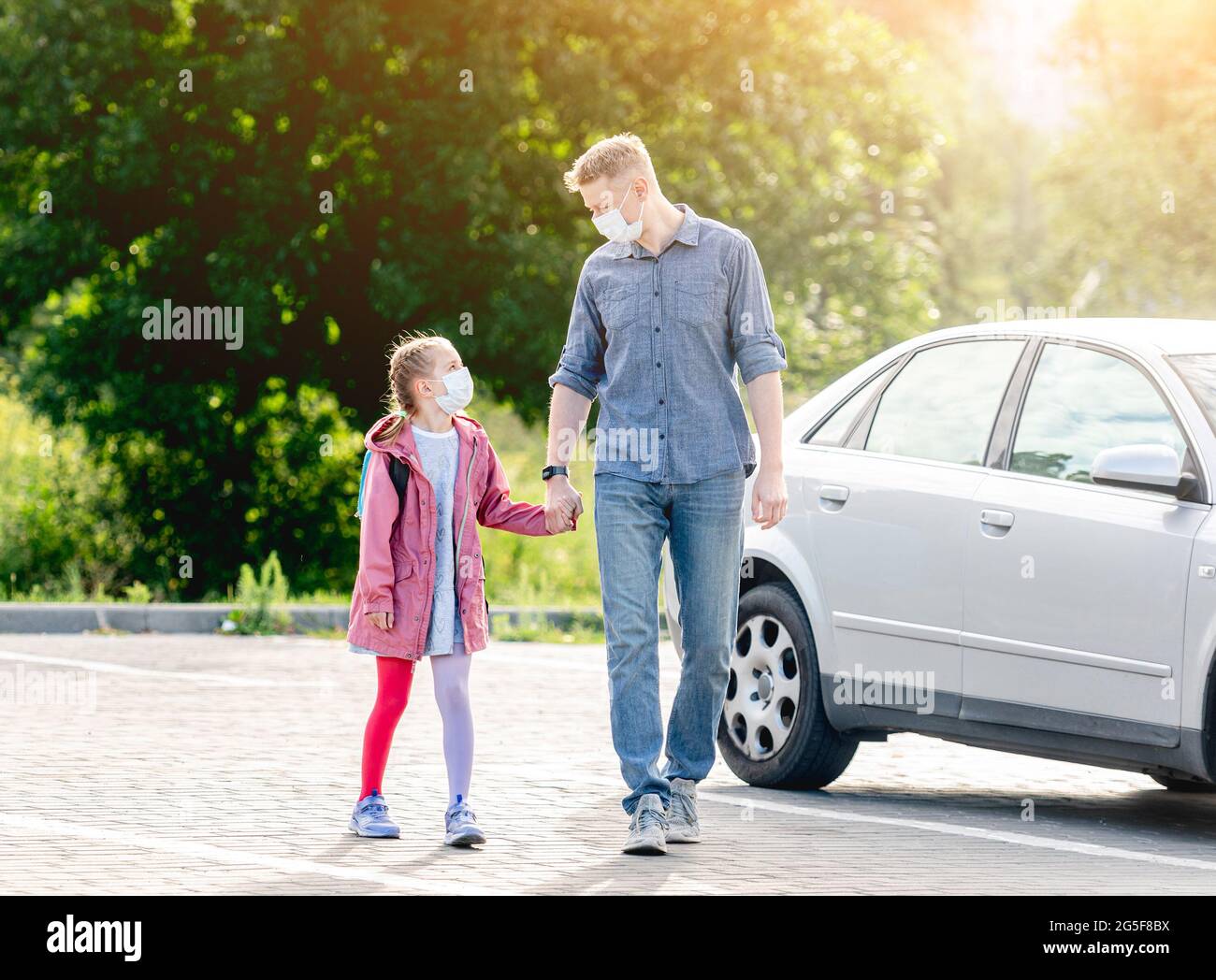 Girl with father going back to school Stock Photo - Alamy