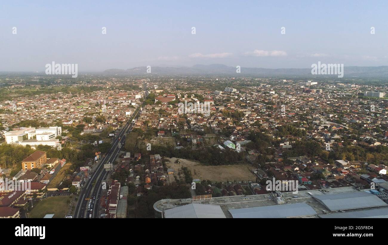 cityscape Yogyakarta with buildings, highway at sunset time. aerial ...