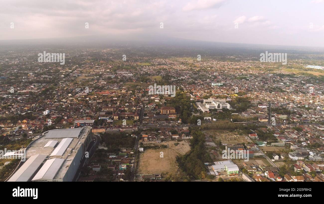 cityscape Yogyakarta with buildings, highway at sunset time. aerial ...