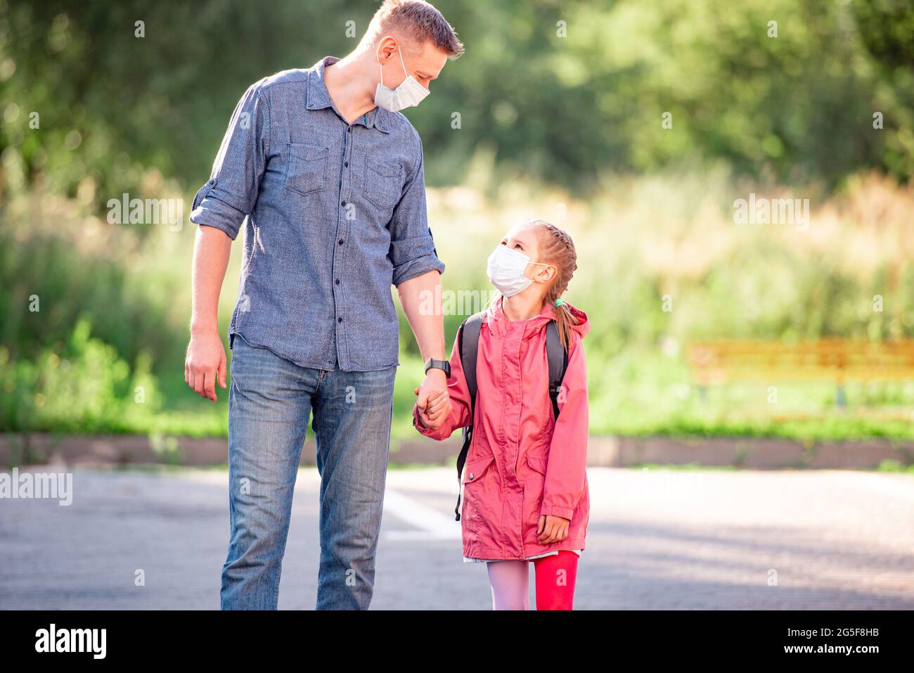 Girl with father going back to school Stock Photo - Alamy