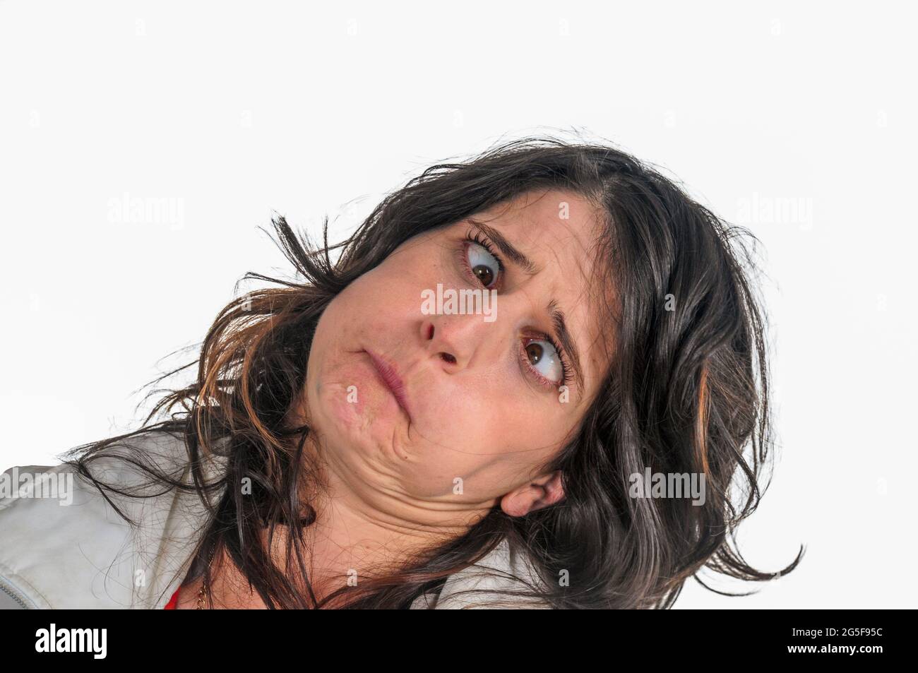 female model pulling faces with an induced Crossed eyed look Stock ...