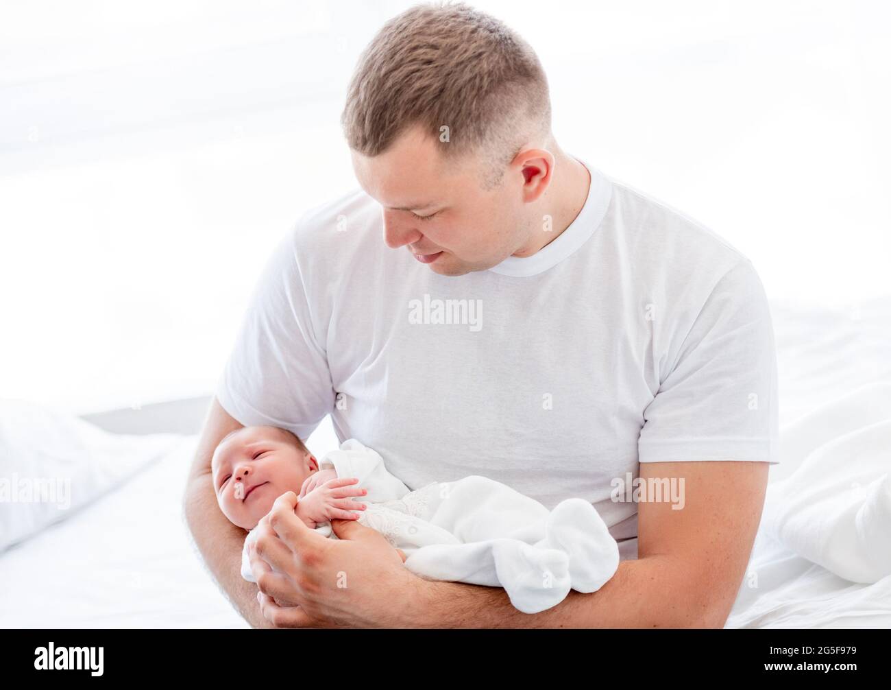 Father with newborn daughter Stock Photo - Alamy