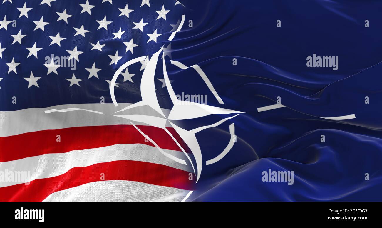 Flag of United States and NATO waving in the wind on flagpole. Close up ...
