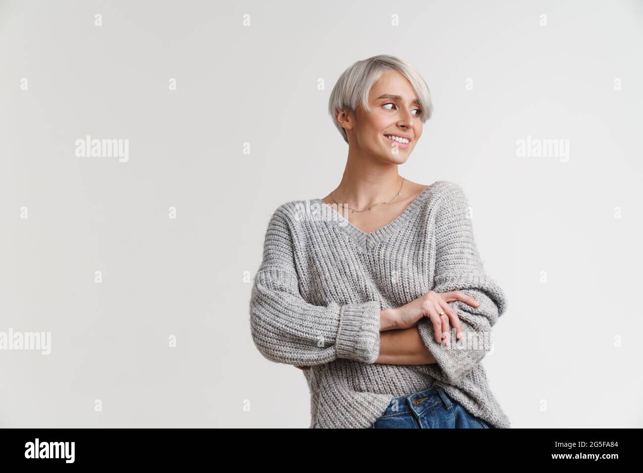 Happy beautiful silver girl smiling and looking aside isolated over ...