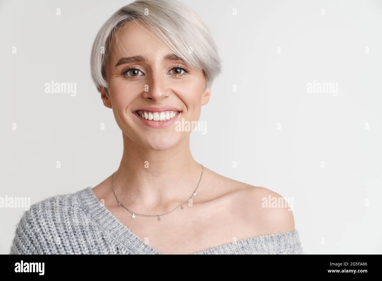 Happy beautiful silver girl smiling and looking at camera isolated over ...