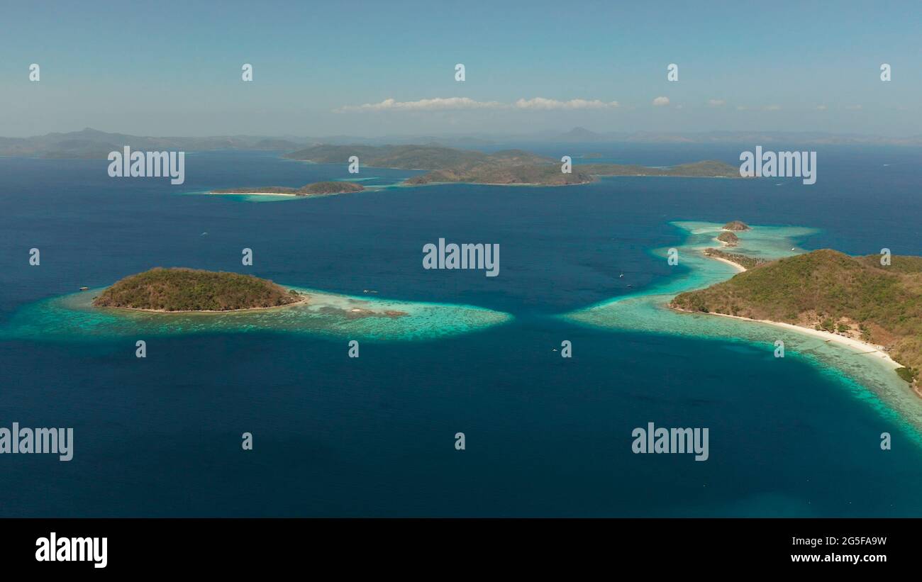 aerial drone tropical islands with blue lagoons, coral reef and sandy ...
