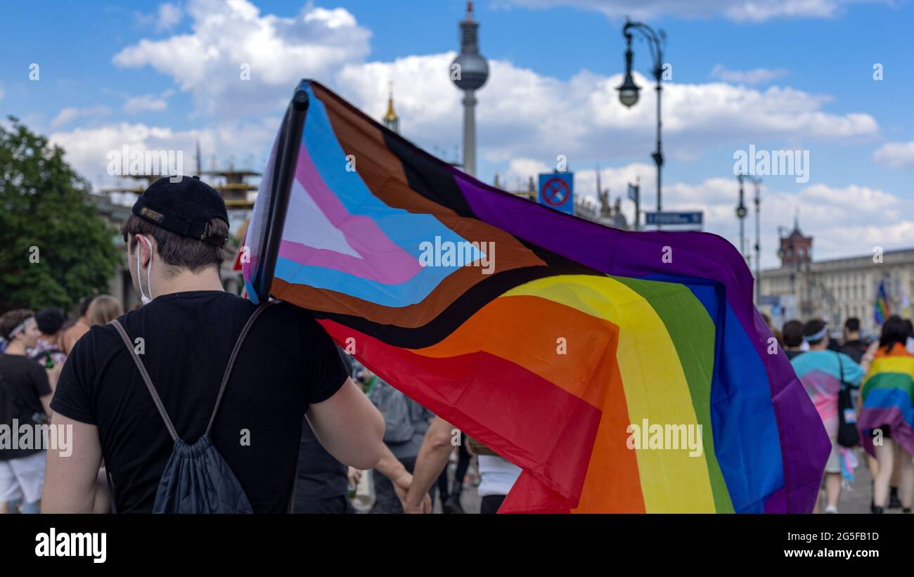 Berlin, Germany - June 26, 2021 - A man with the traditional rainbow ...