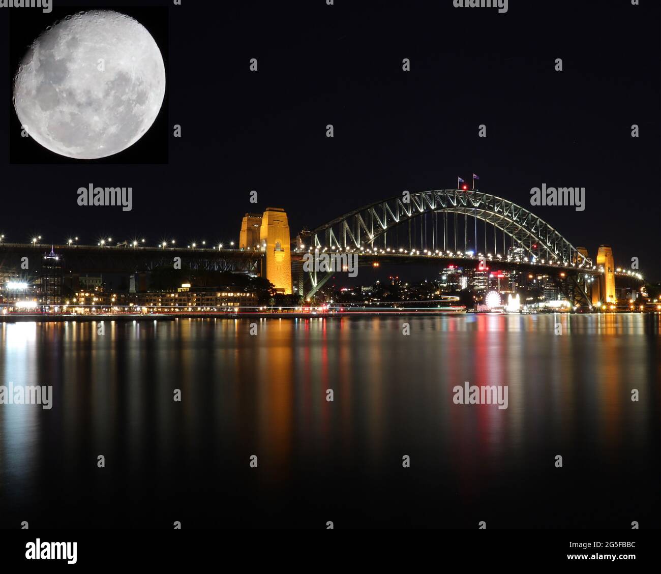 Panorama view of Sydney Harbour at night with large full moon in the ...