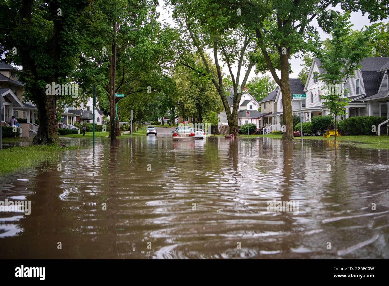 A street in Ann Arbor, MI experiences the aftermath of severe flooding ...