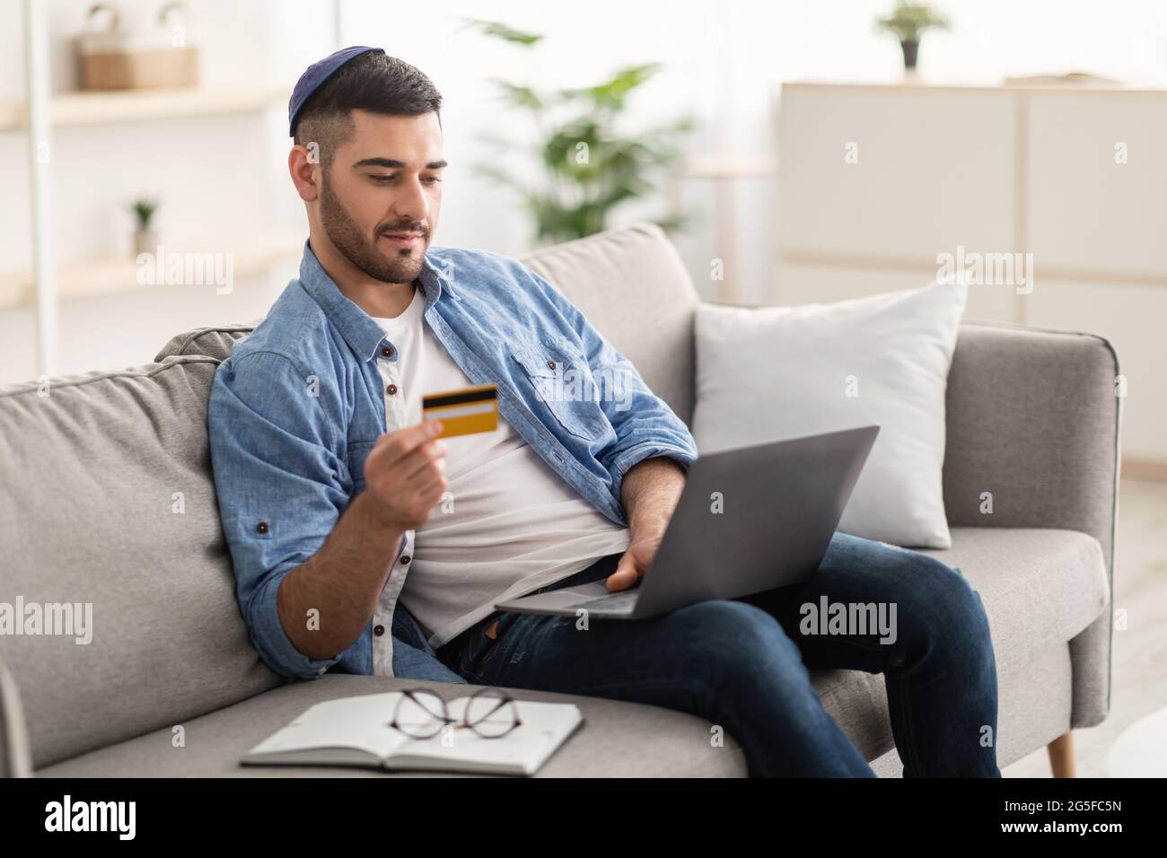Electronic Payment Service Concept. Portrait of casual young jewish ...
